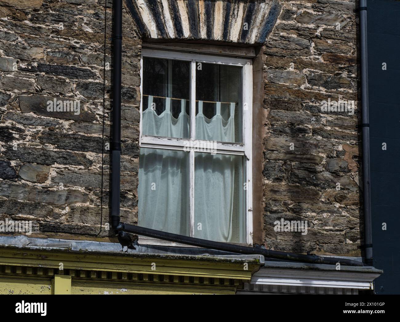 Mysterious looking window with old fashioned net curtains Stock Photo ...