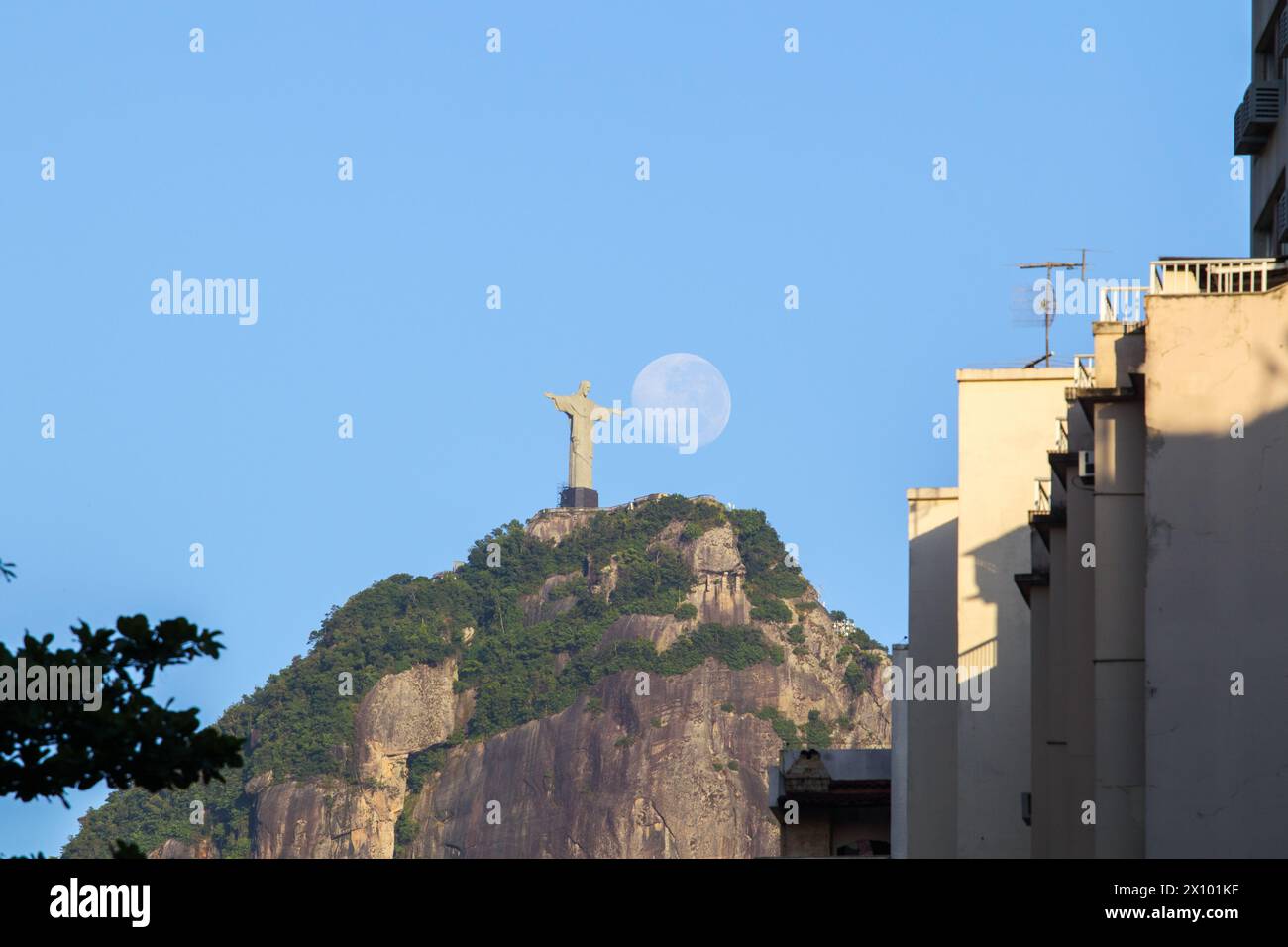Statue of Christ the Redeemer and the full moon in Rio de Janeiro ...