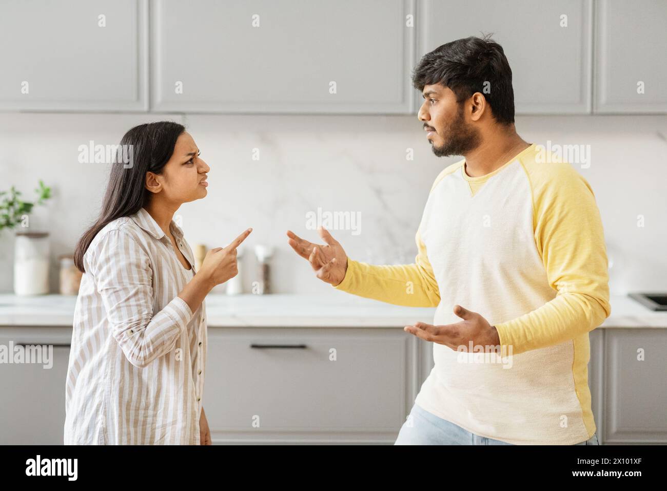 Indian couple arguing in a kitchen interior Stock Photo - Alamy