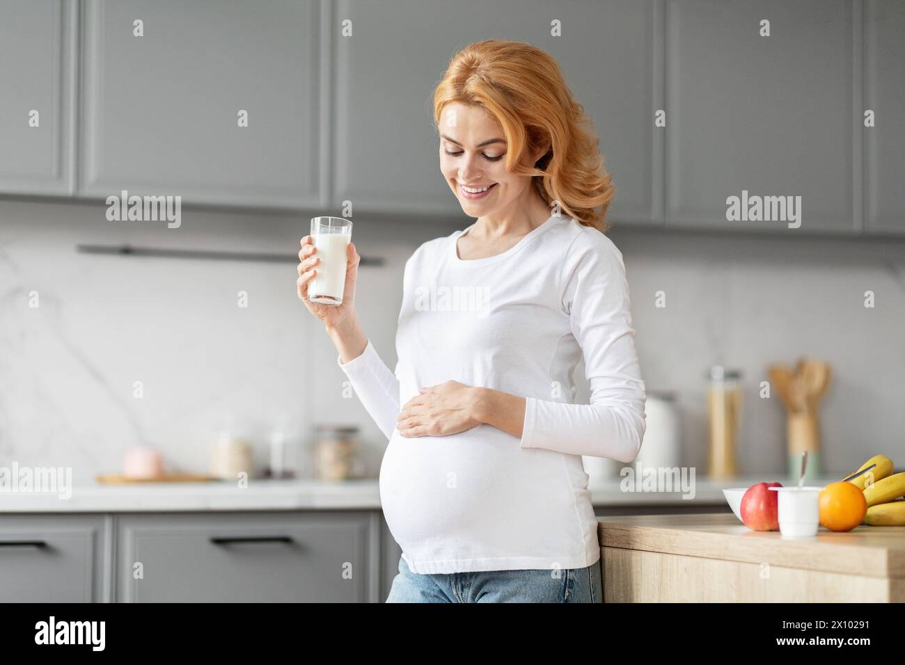 Blonde pregnant woman enjoying pregnancy hi-res stock photography and ...
