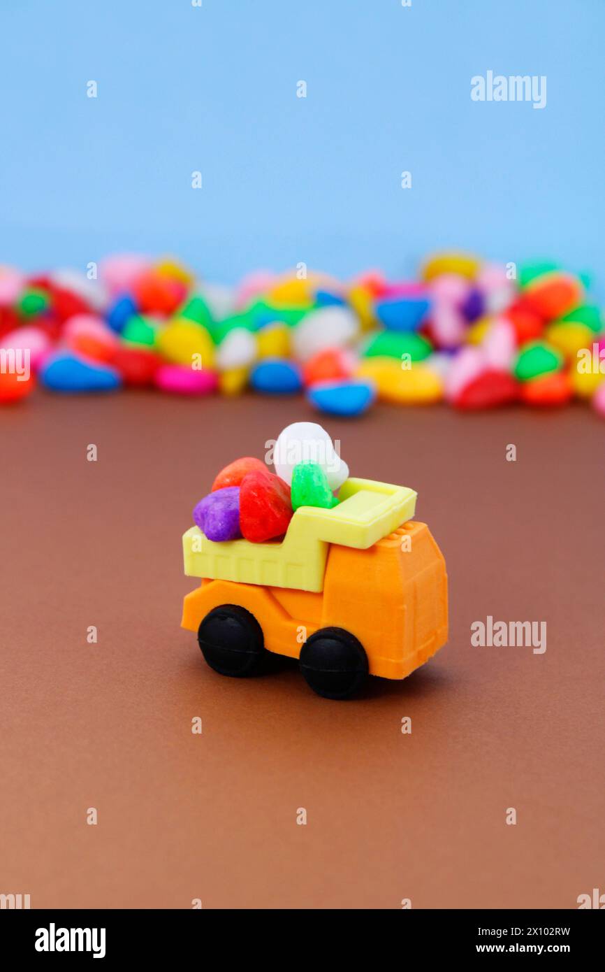 Cargo truck transporting colorful stones Stock Photo - Alamy
