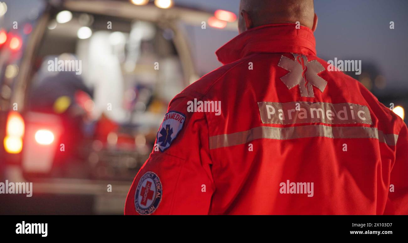 Back, man and paramedic walking to ambulance for emergency, ems service ...