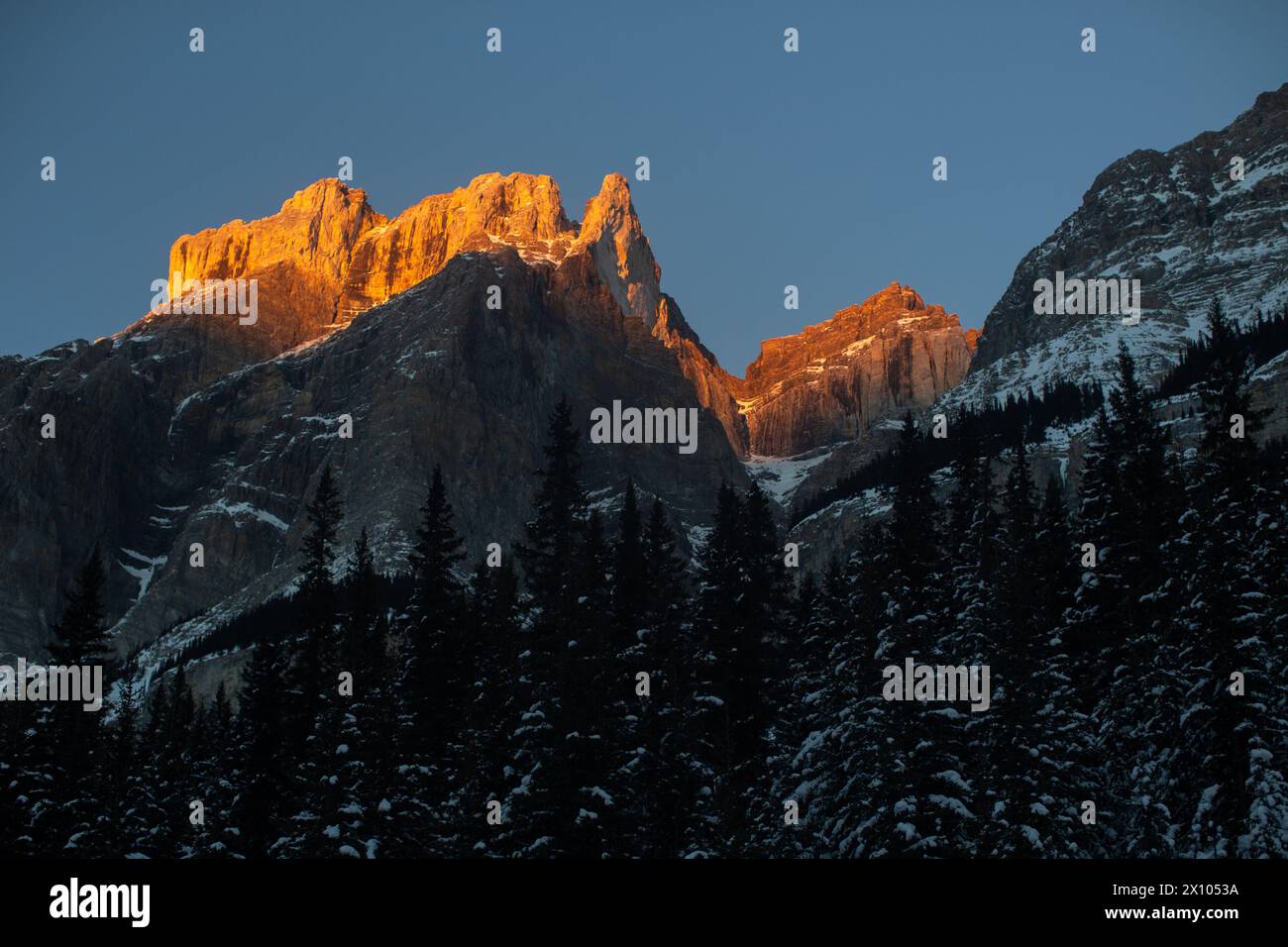 Last light on the cliffs of the Ramparts on the Icefields Parkway road ...