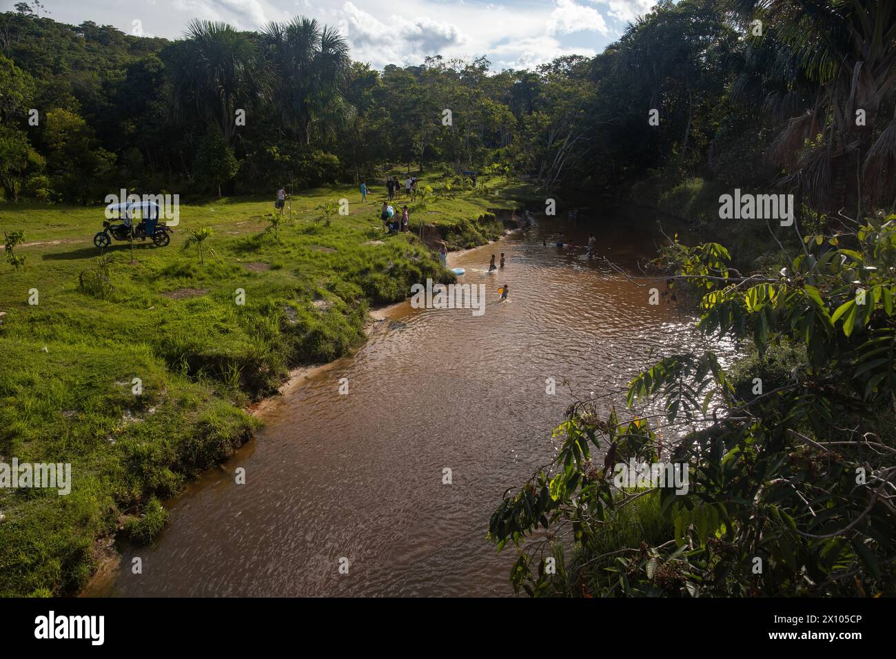 Locals swim in a popular swimming hole near Nauta in the Amazon ...