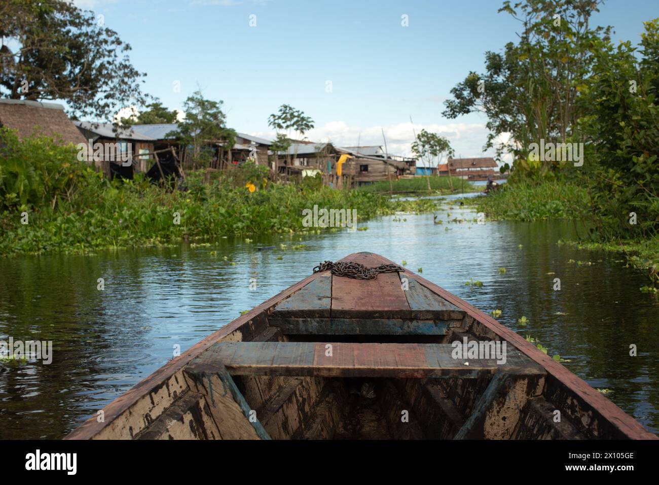 Huts on stilts where the Itaya River meets the Amazon river outside of ...