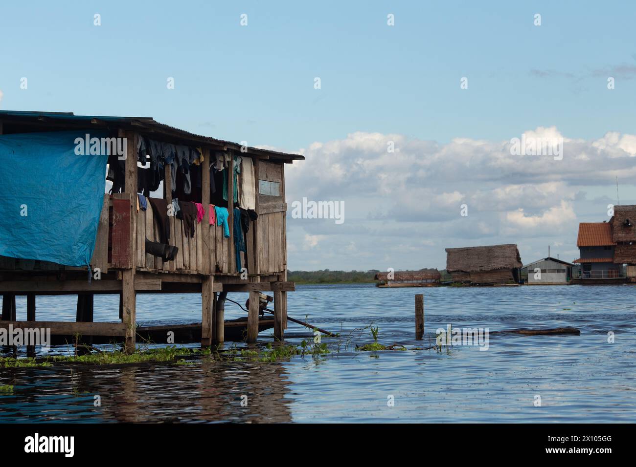Huts on stilts where the Itaya River meets the Amazon river outside of ...