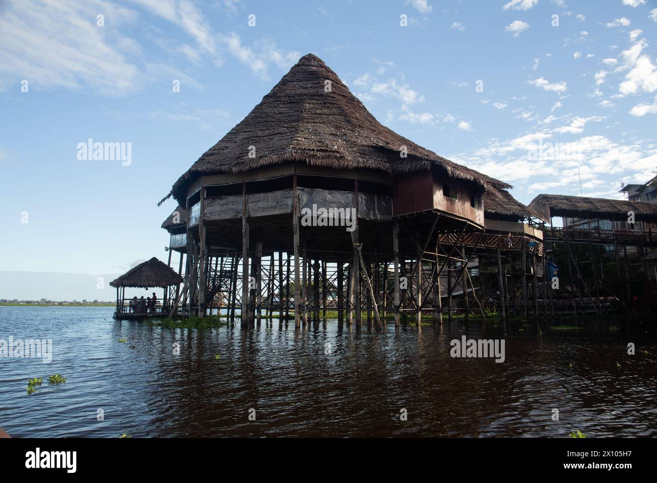 Huts on stilts where the Itaya River meets the Amazon river outside of ...