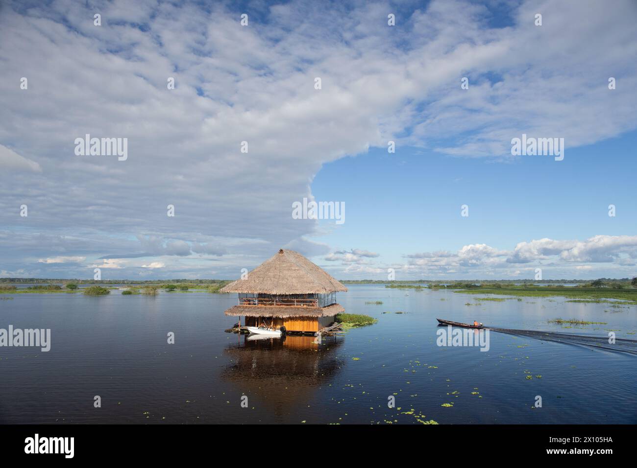 Views of a floating house along the waterfront Boulevard in Iquitos ...