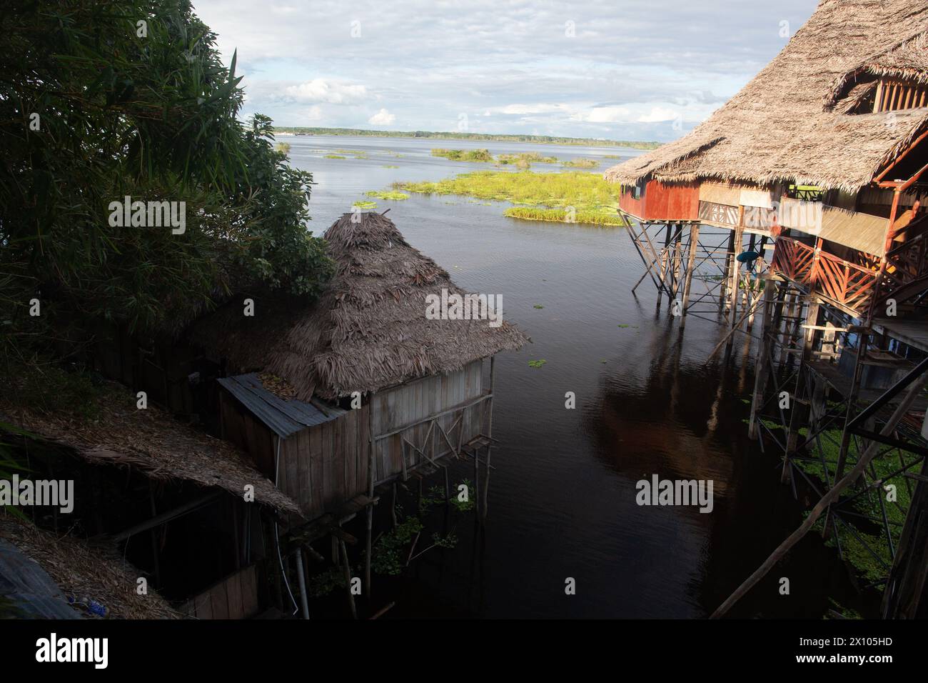Huts on stilts where the Itaya River meets the Amazon river outside of ...