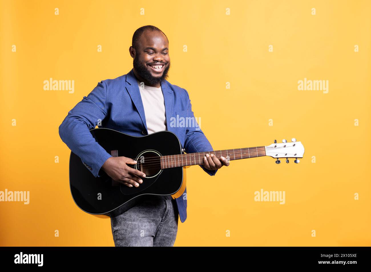 Musician tunes guitar during concert hi-res stock photography and ...