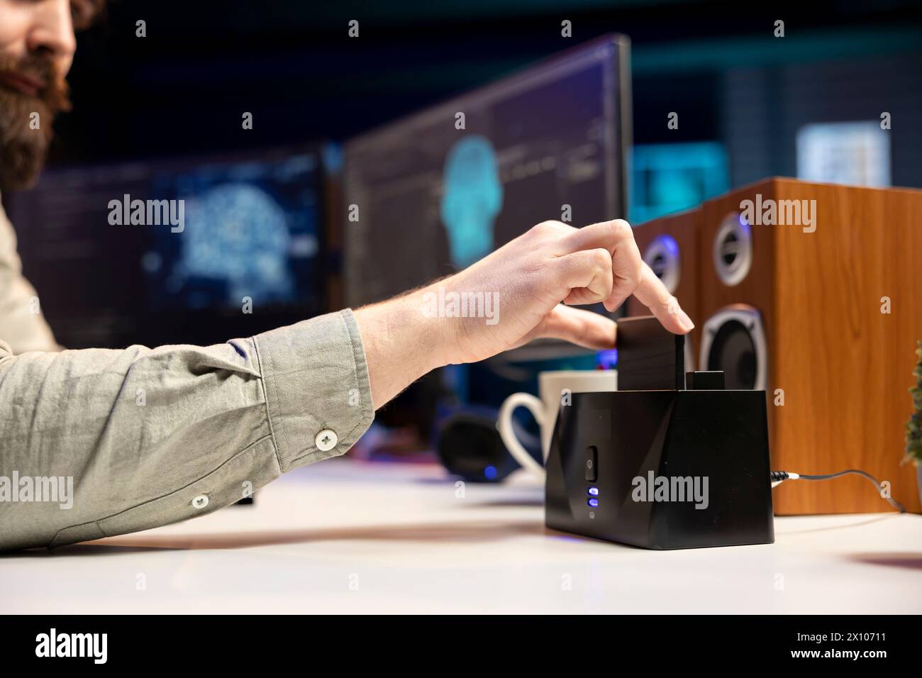 Software engineer inserting disk in computer with rogue self aware AI ...