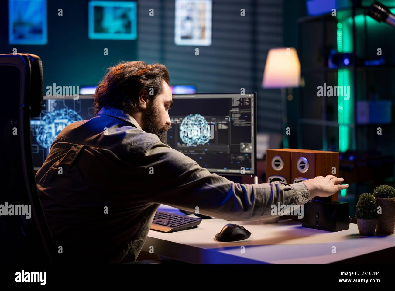Software technician inserting disk in computer with rogue superintelligence AI to use it for ...