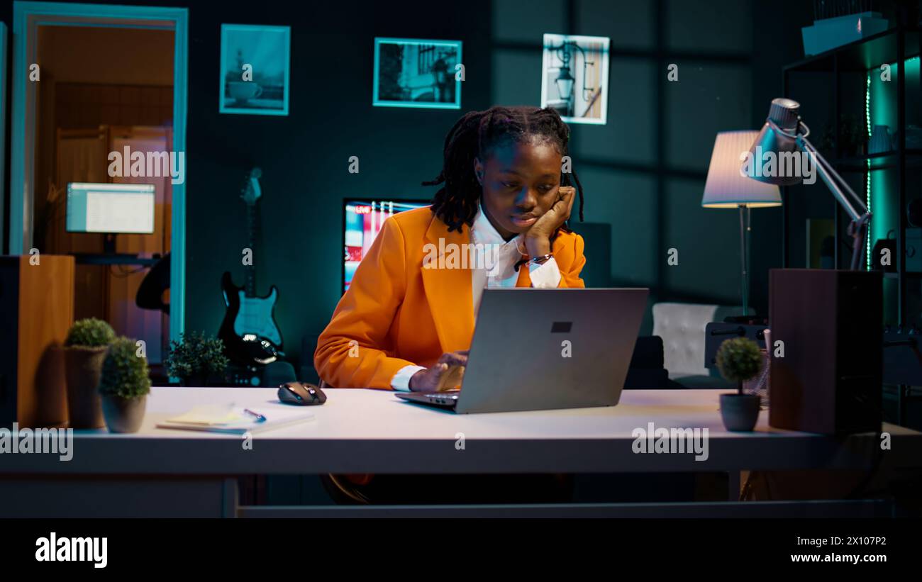 Student working under pressure to finish homework at midnight, trying ...