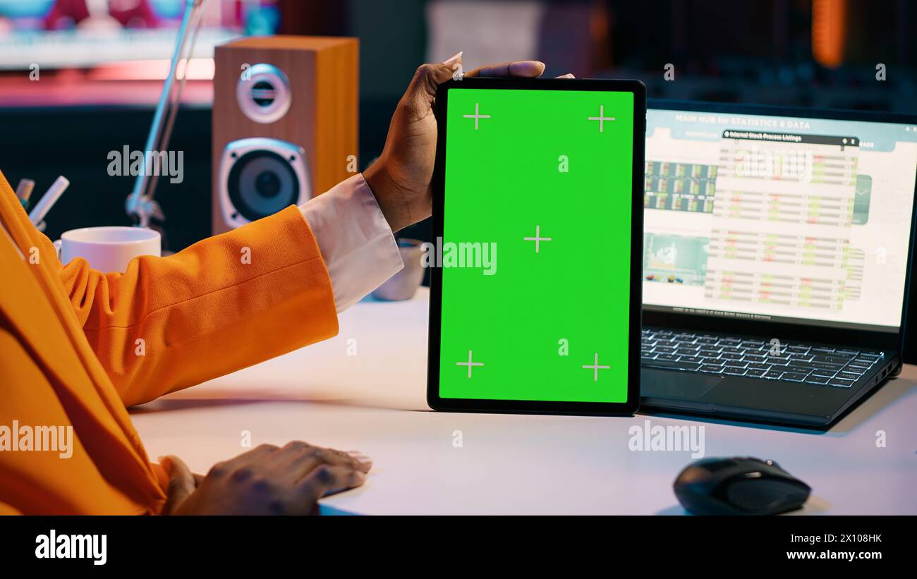 African american girl holding tablet with greenscreen layout ...