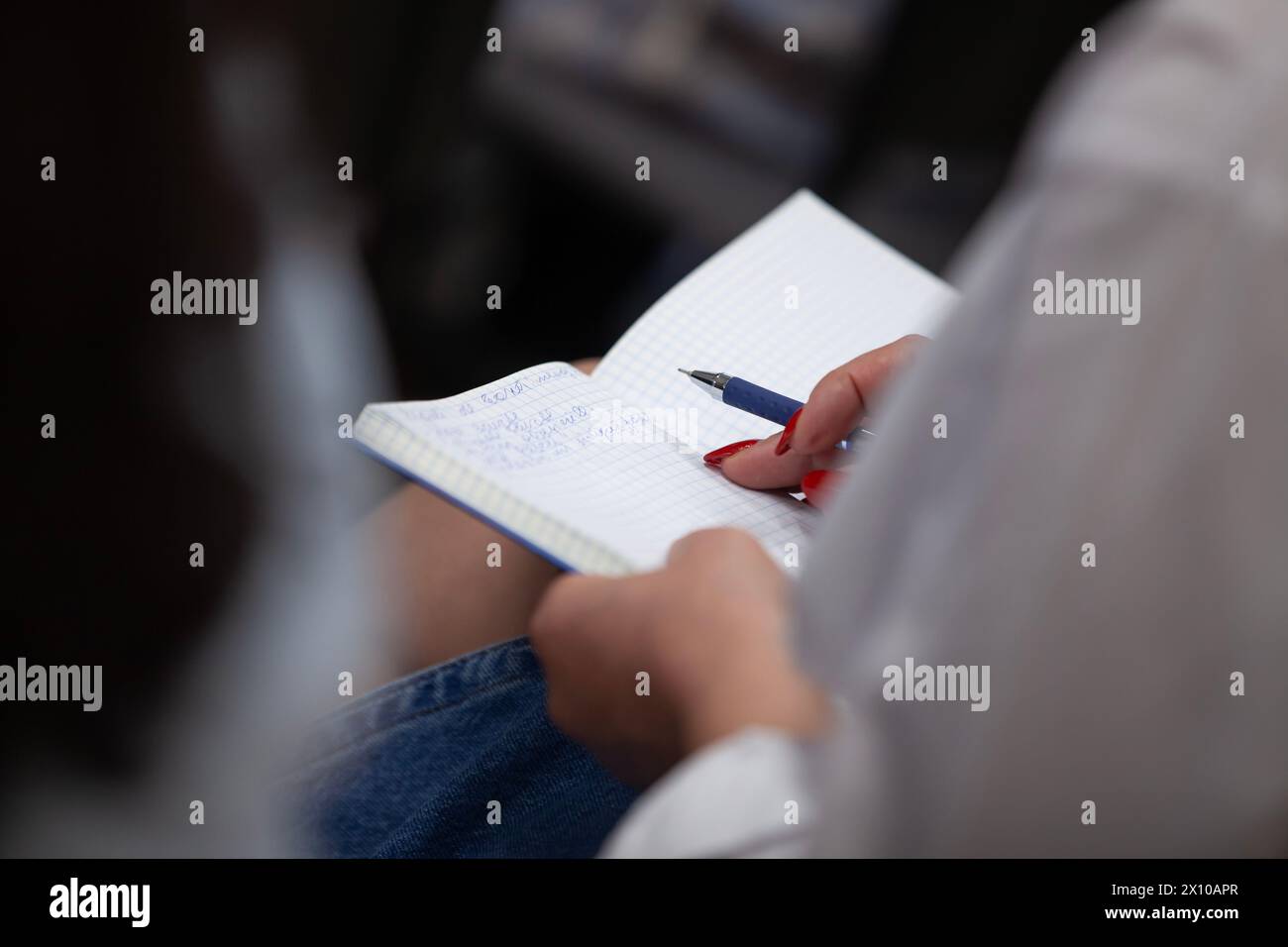 Woman taking notes pen hi-res stock photography and images - Alamy
