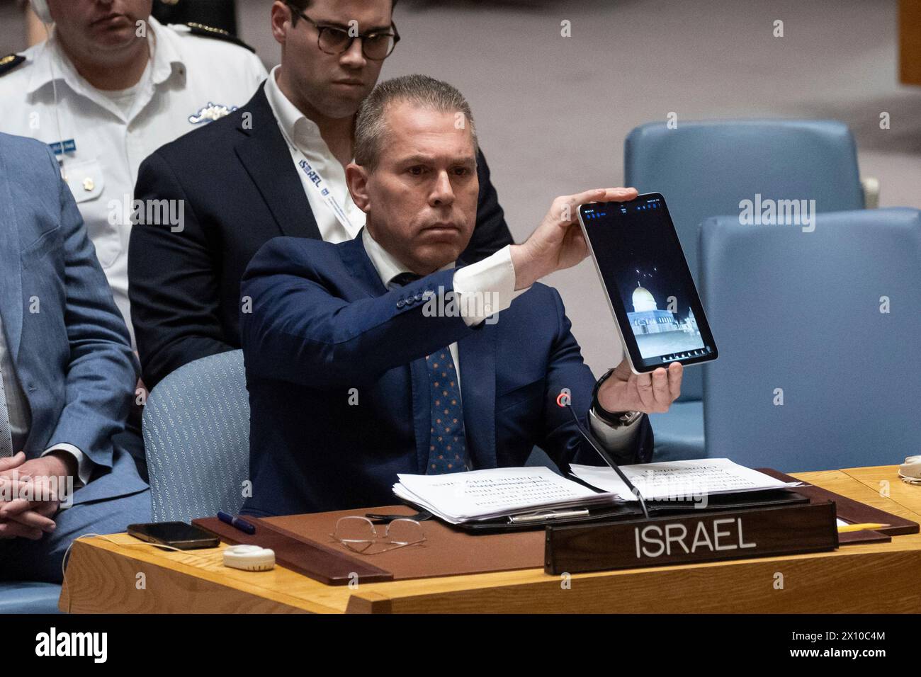 Israel’s U.N. Ambassador Gilad Erdan shows a video of Iranian missiles ...