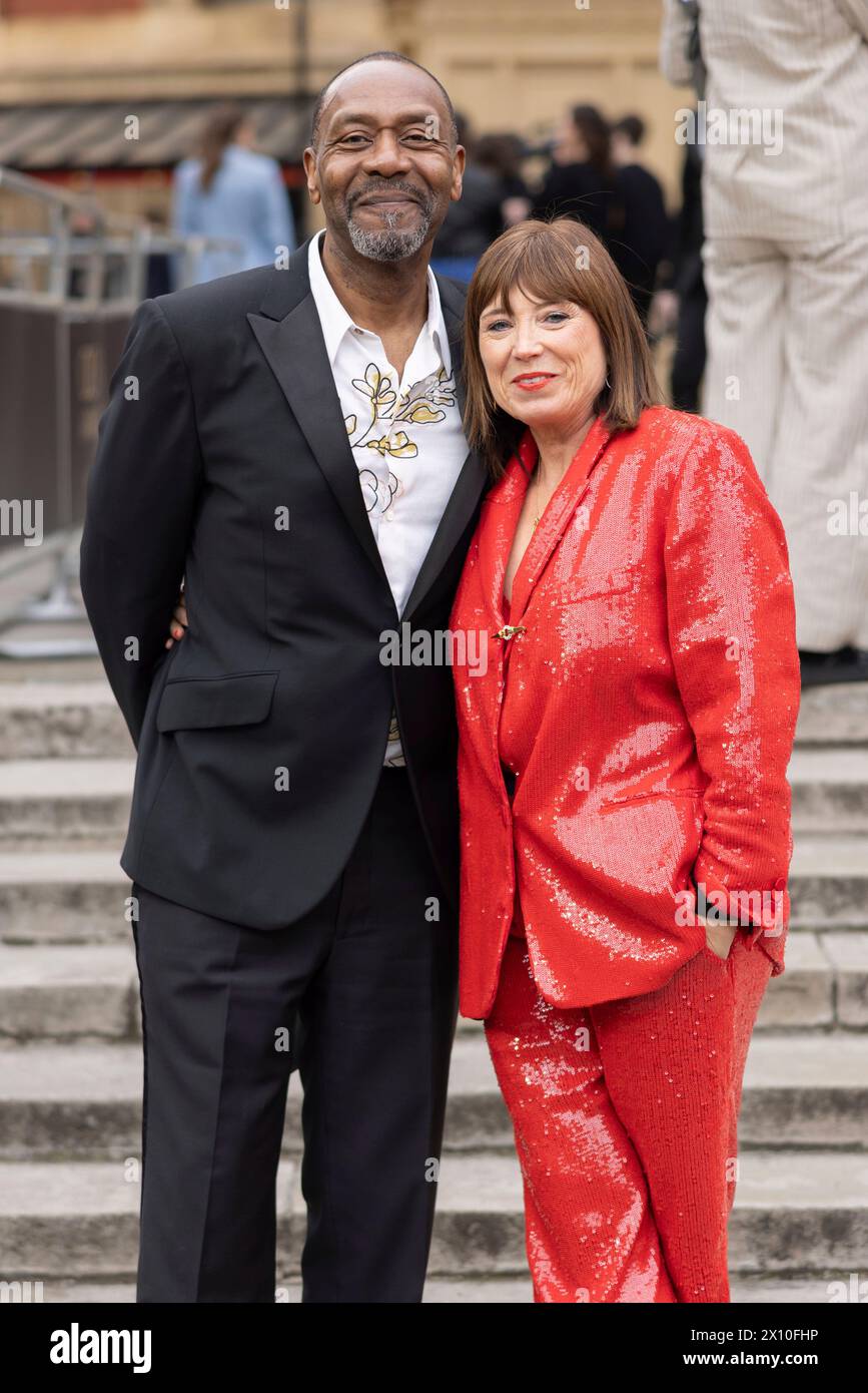Lenny Henry, left, and Lisa Makin pose for photographers upon arrival ...