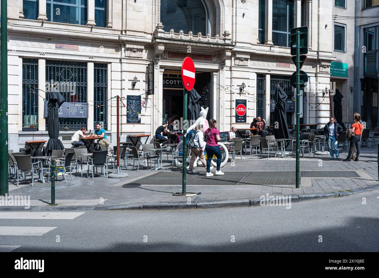 Brussels city center, Belgium - April 13, 2024 - People sitting at ...