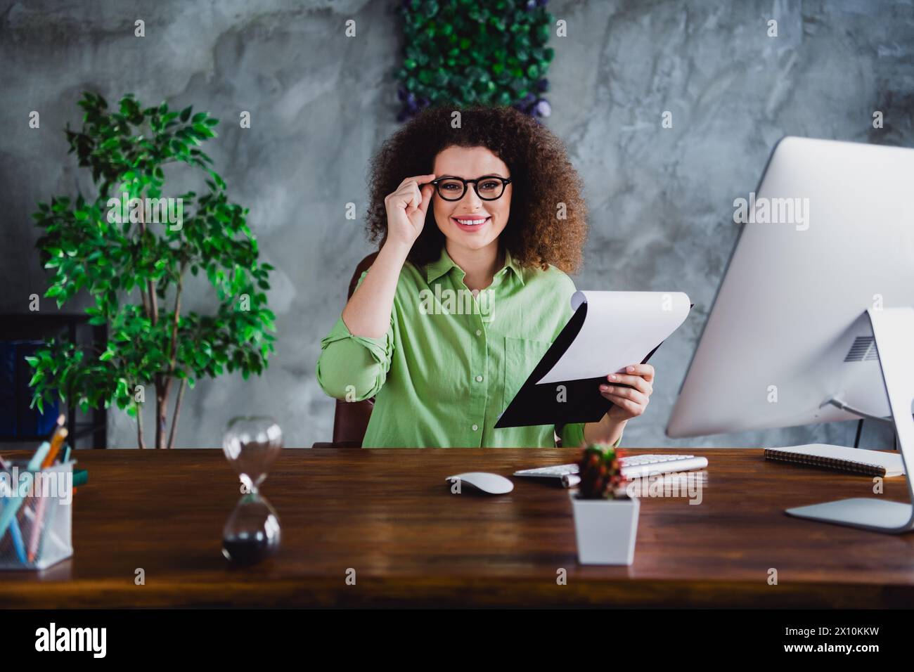 Photo of charming nice successful woman office assistant sitting ...