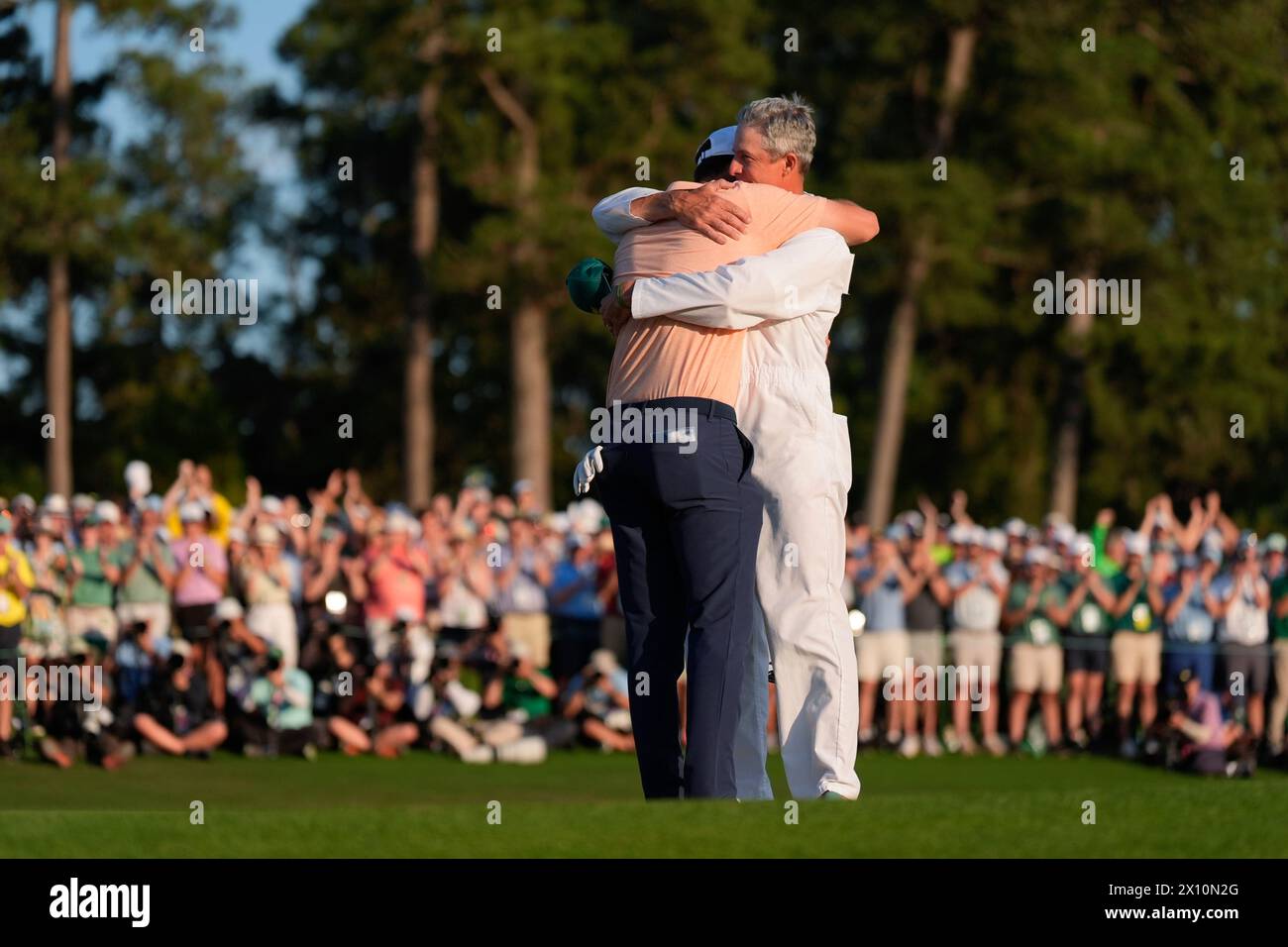 Scottie Scheffler celebrates with his caddie Ted Scott after winning ...
