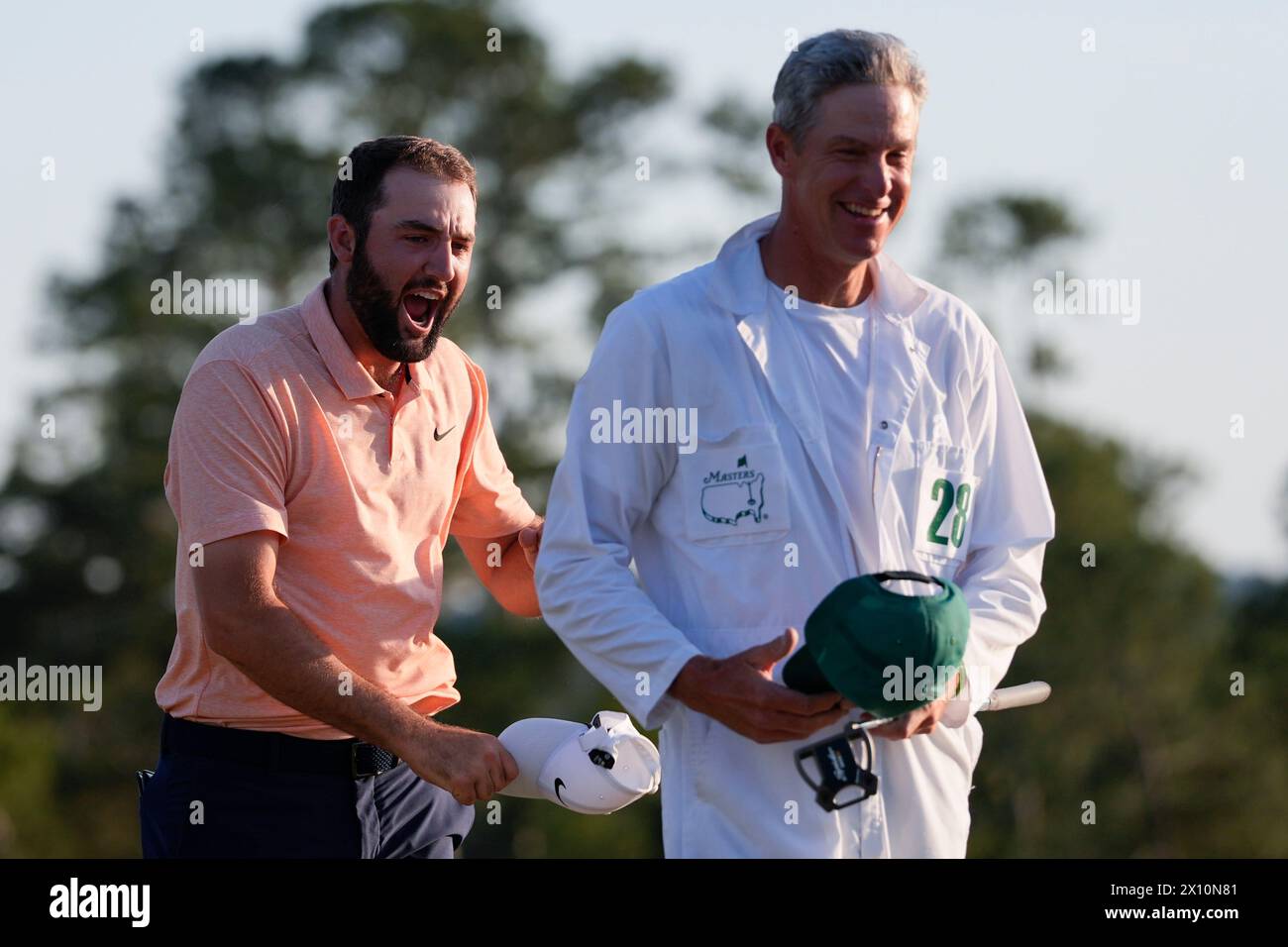 Scottie Scheffler celebrates with his caddie Ted Scott after winning ...