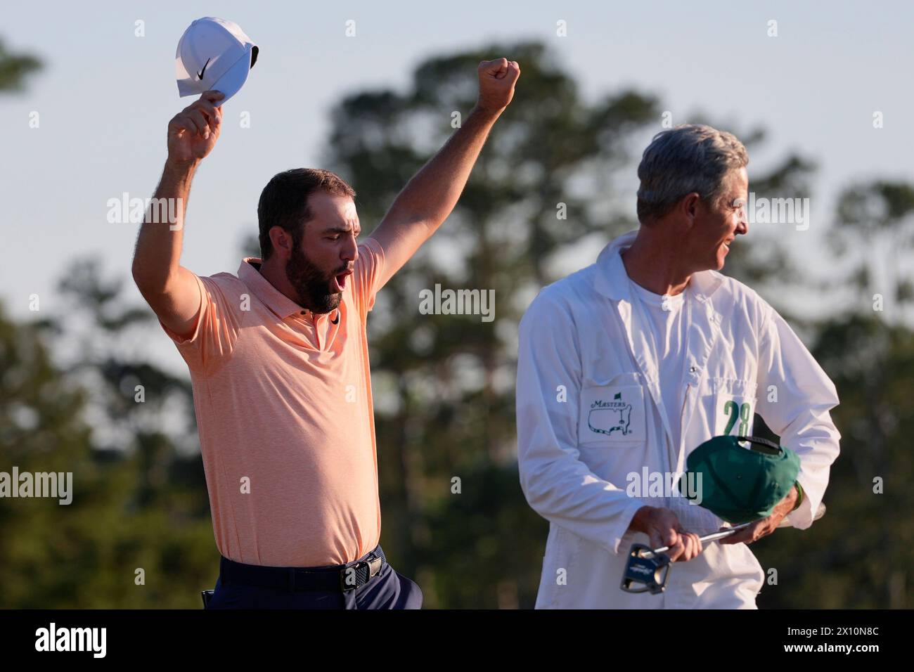 Scottie Scheffler celebrates with his caddie Ted Scott after winning ...
