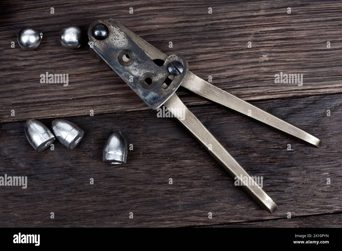 Antique old west bullet mold with bullets for revolver. Isolated on ...