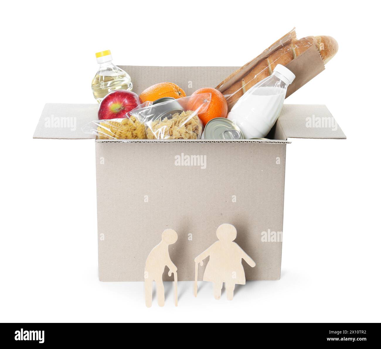 Humanitarian aid for elderly people. Cardboard box with donation food ...