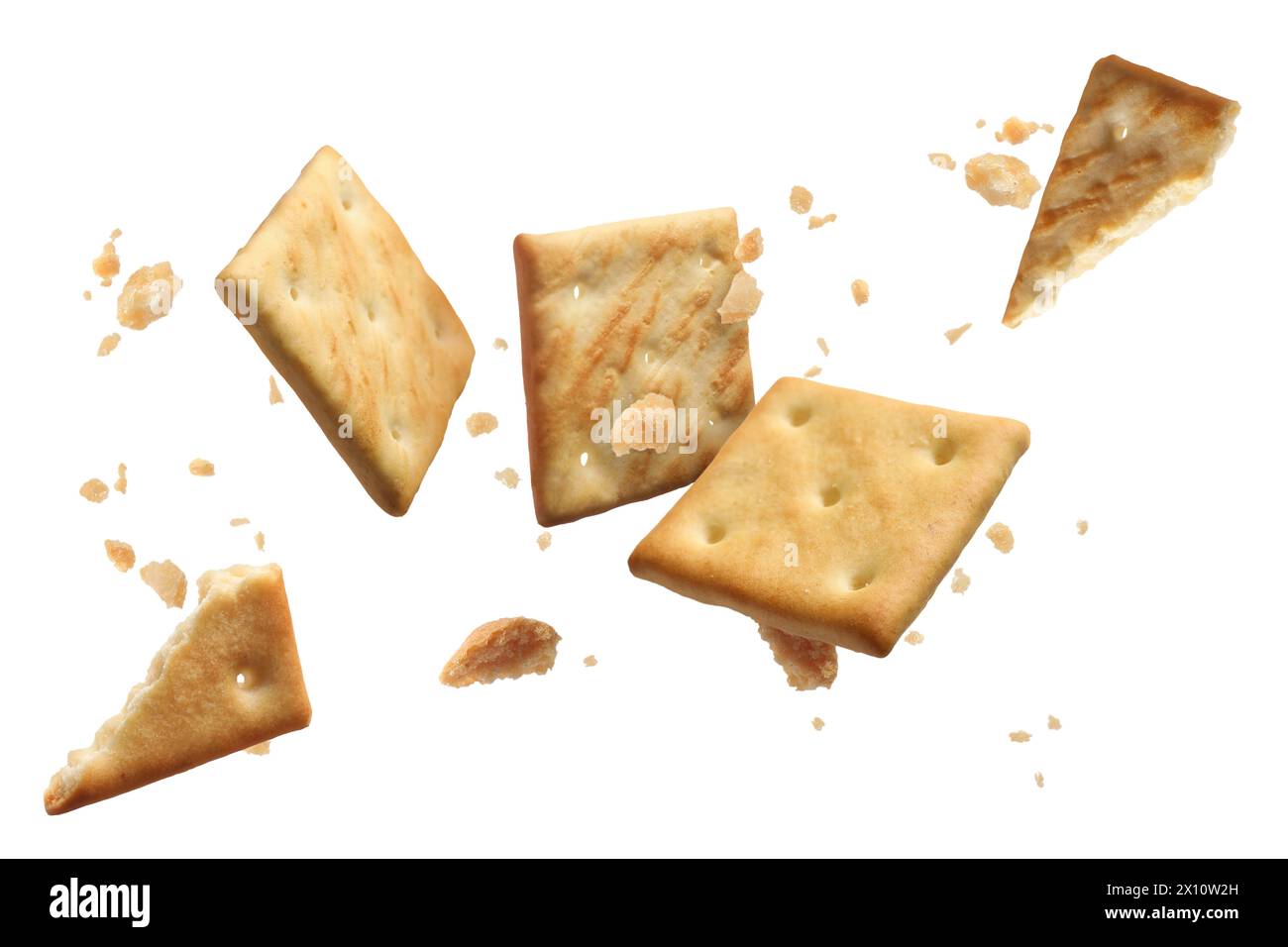 Tasty dry crackers falling on white background Stock Photo - Alamy