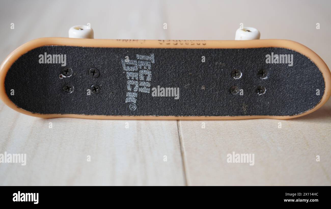 Deck from the Tech Deck's fingerboard which is placed sideways on the ...