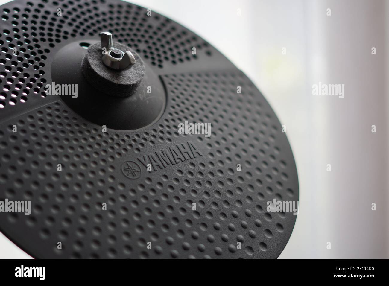Cymbal from the Yamaha drum dtx series with a blurred white background ...