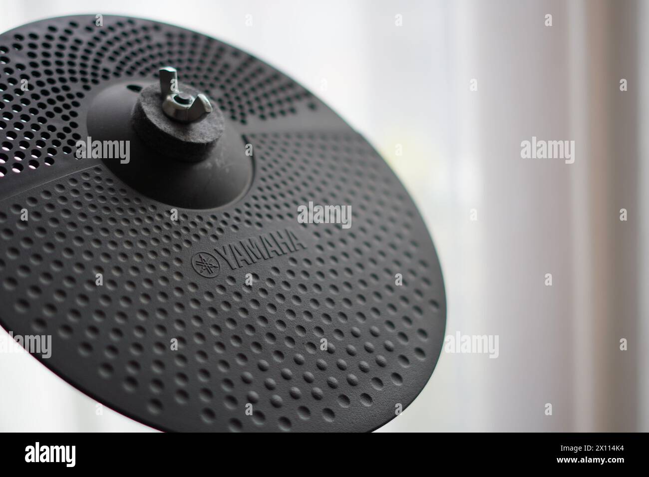 Cymbal from the Yamaha drum dtx series with a blurred white background ...