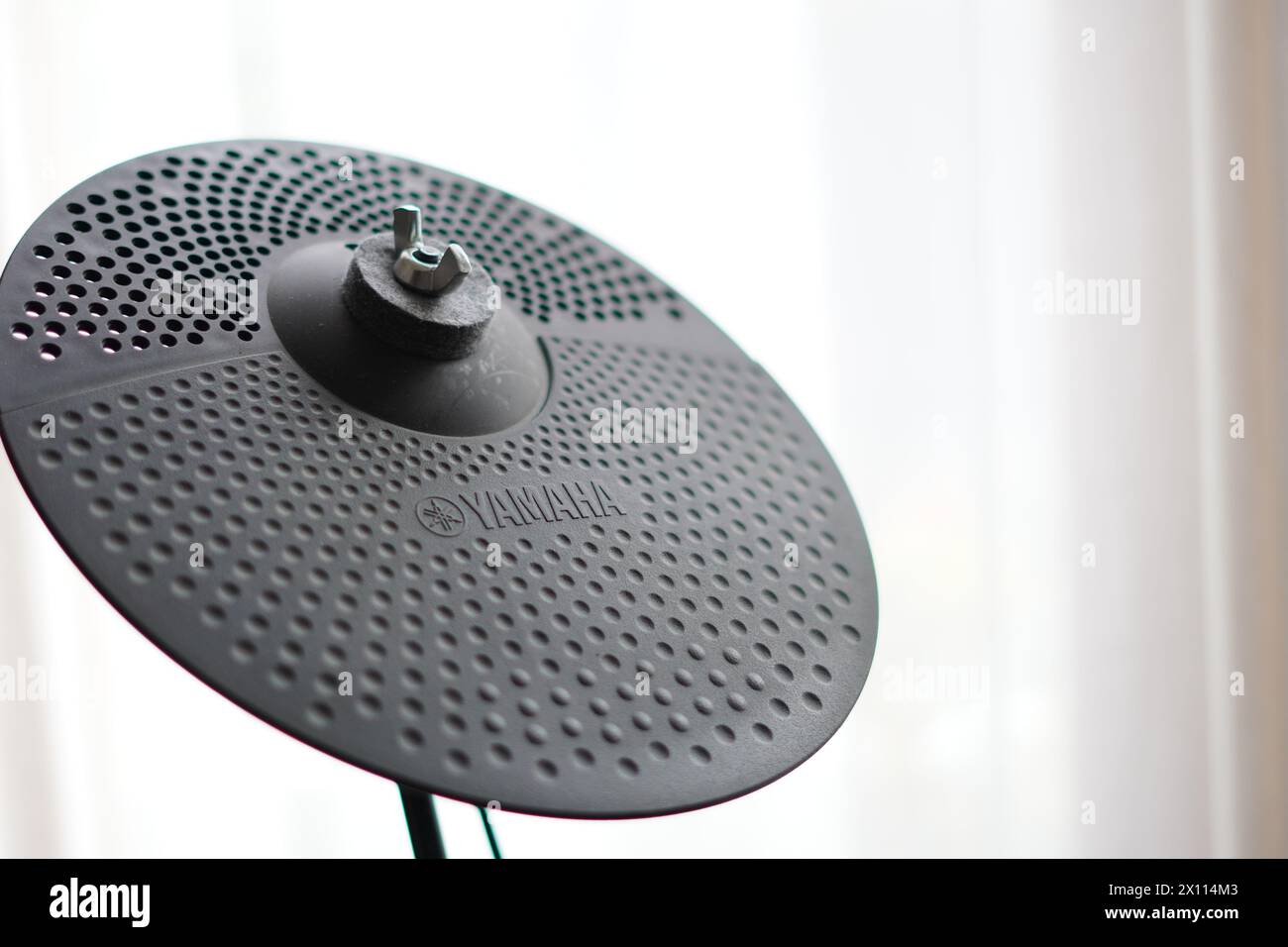 Cymbal from the Yamaha drum dtx series with a blurred white background ...