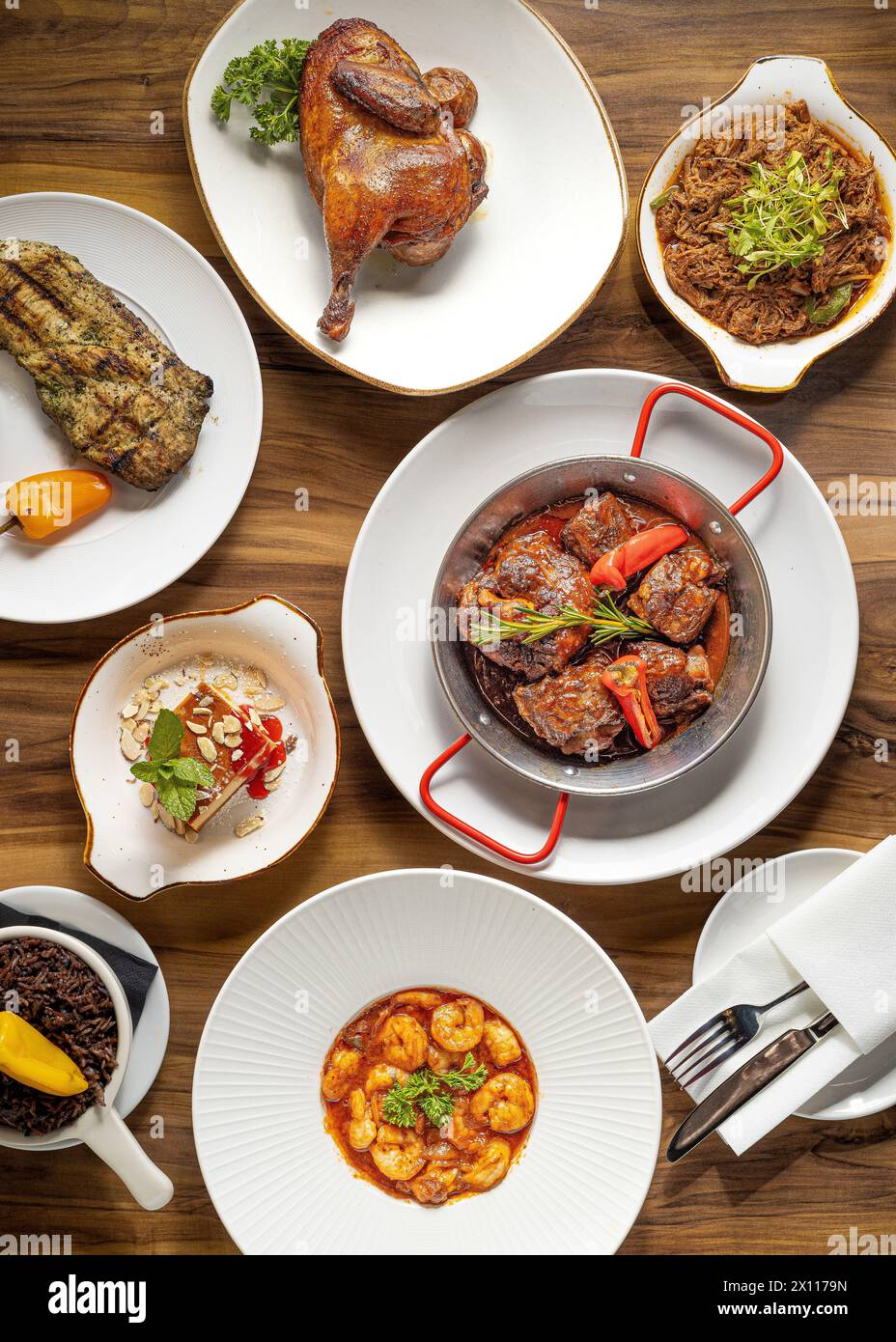 wood table set with traditional foods dishes top view Stock Photo - Alamy