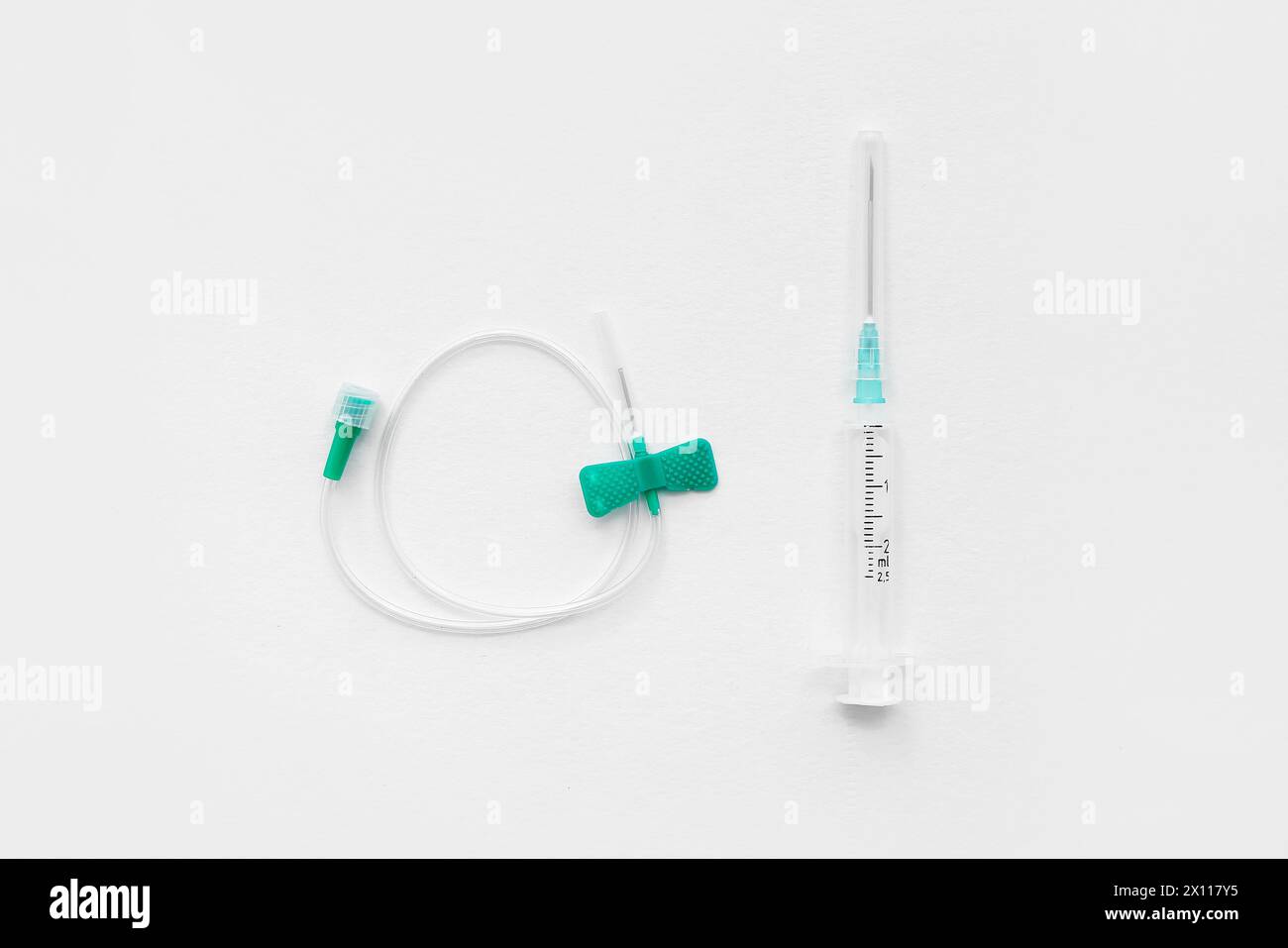 Empty syringe with catheter on white background Stock Photo - Alamy