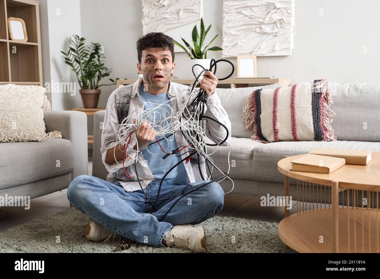 Electrocuted man with burnt face and wires at home Stock Photo - Alamy