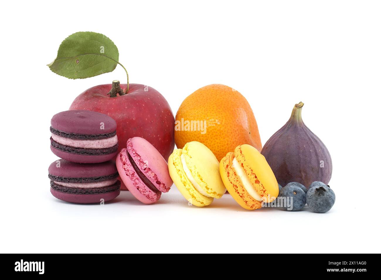 Colorful French macarons and assortment of fruits isolated on white ...