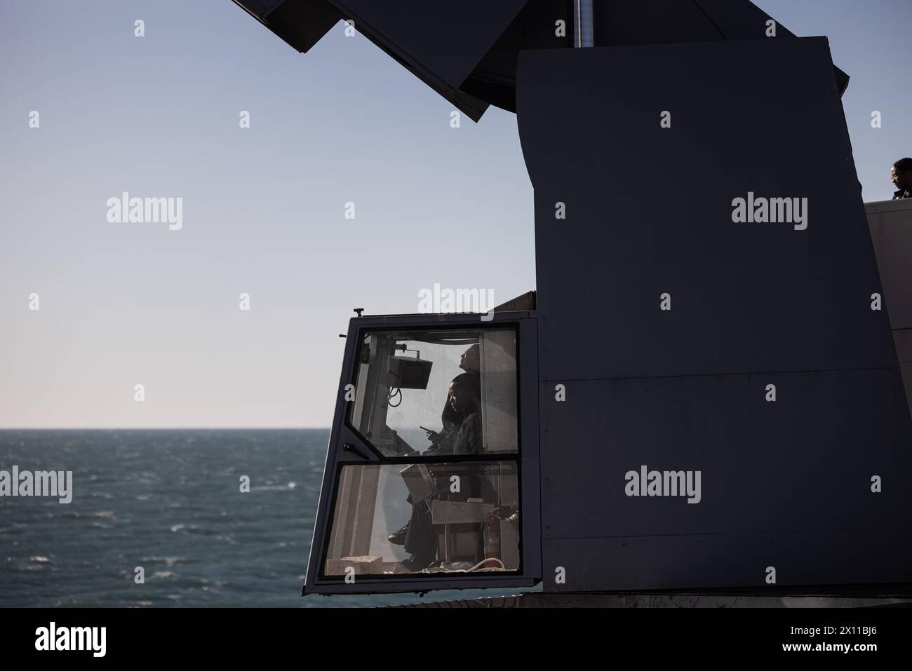 U.S. Navy Sailors with the USS New York (LPD 21) operate a crane aboard ...