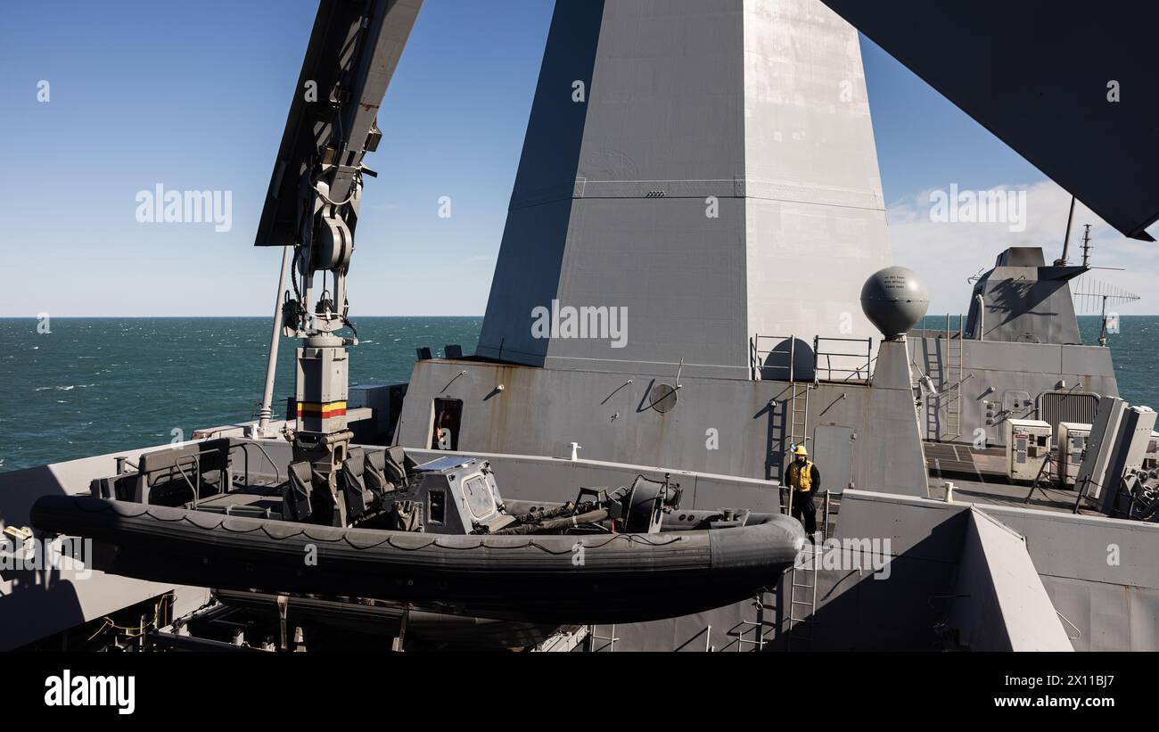 U.S. Navy Sailors with the USS New York (LPD 21) operate a crane aboard ...