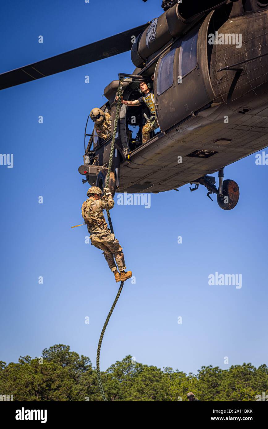 2024 Best Ranger Competition competitors fast rope from a UH-60 ...