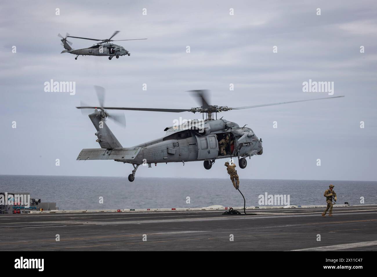 240413-N-LM220-1711 PACIFIC OCEAN (April 13, 2024) Members of the ...