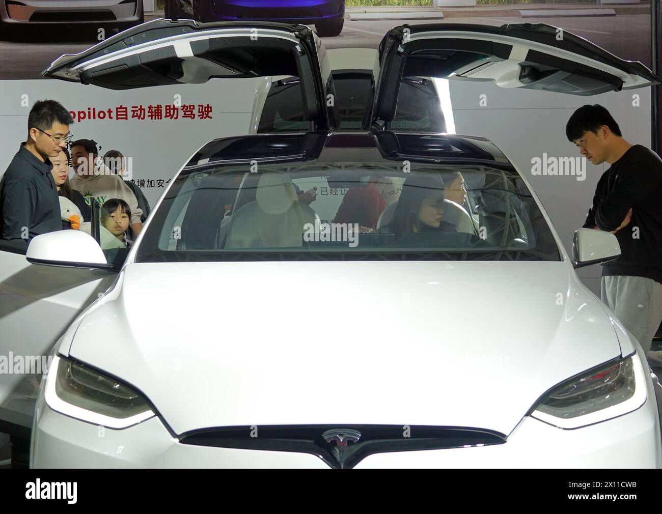 Yantai, China. 15th Apr, 2024. Visitors are viewing a Tesla Model X ...