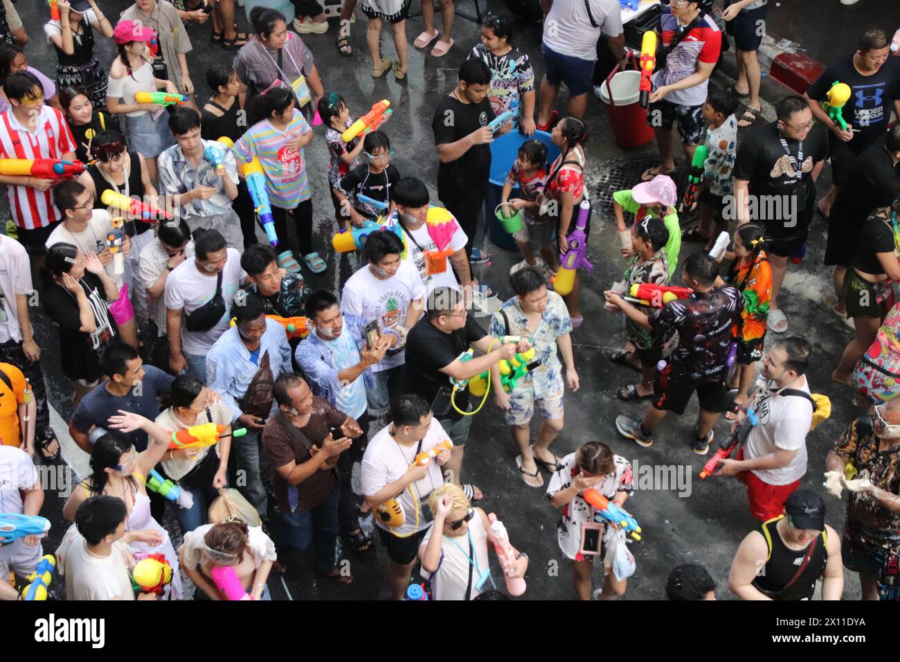 Bangkok, Thailand - April 14, 2024 : People celebrating Songkran festival on Si Lom Rd. Water ...