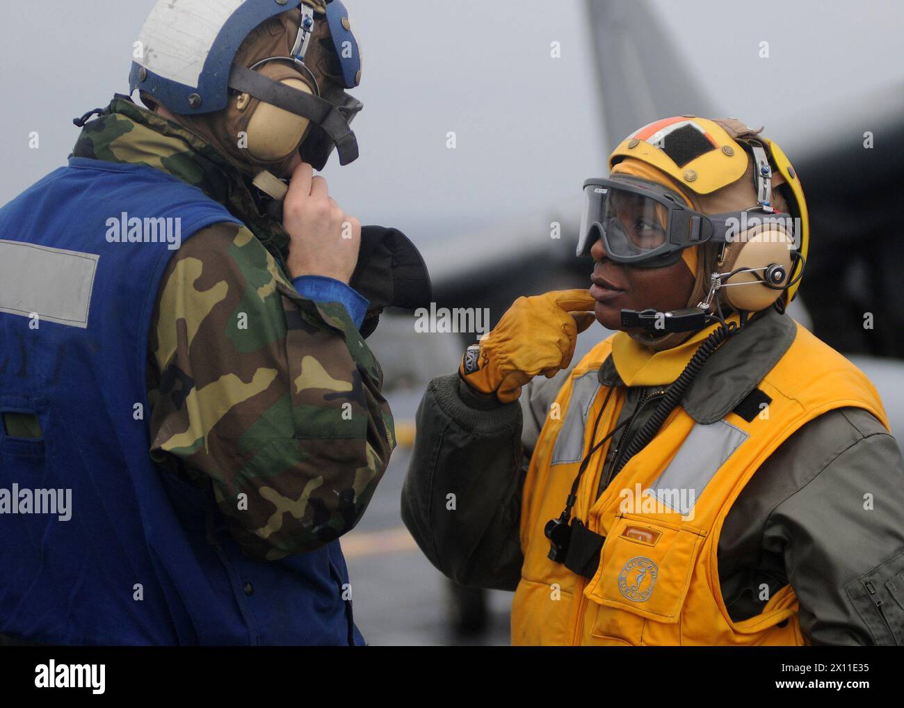 Chief Warrant Officer LaTonya Wallace, right, speaks with Airman ...