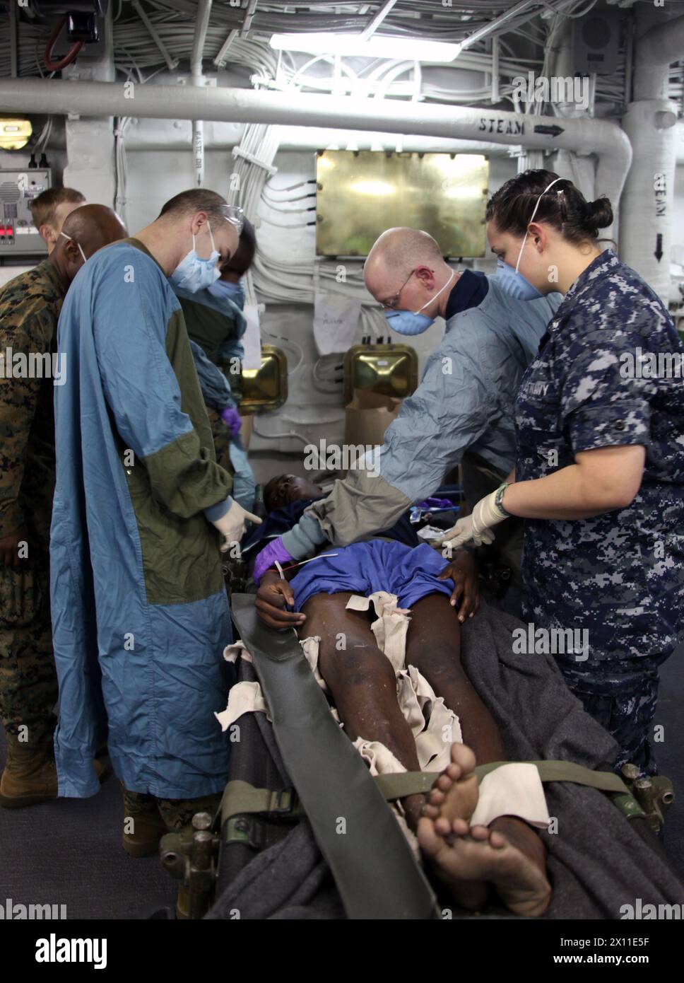 Medical personnel from the amphibious assault ship USS Bataan and the ...