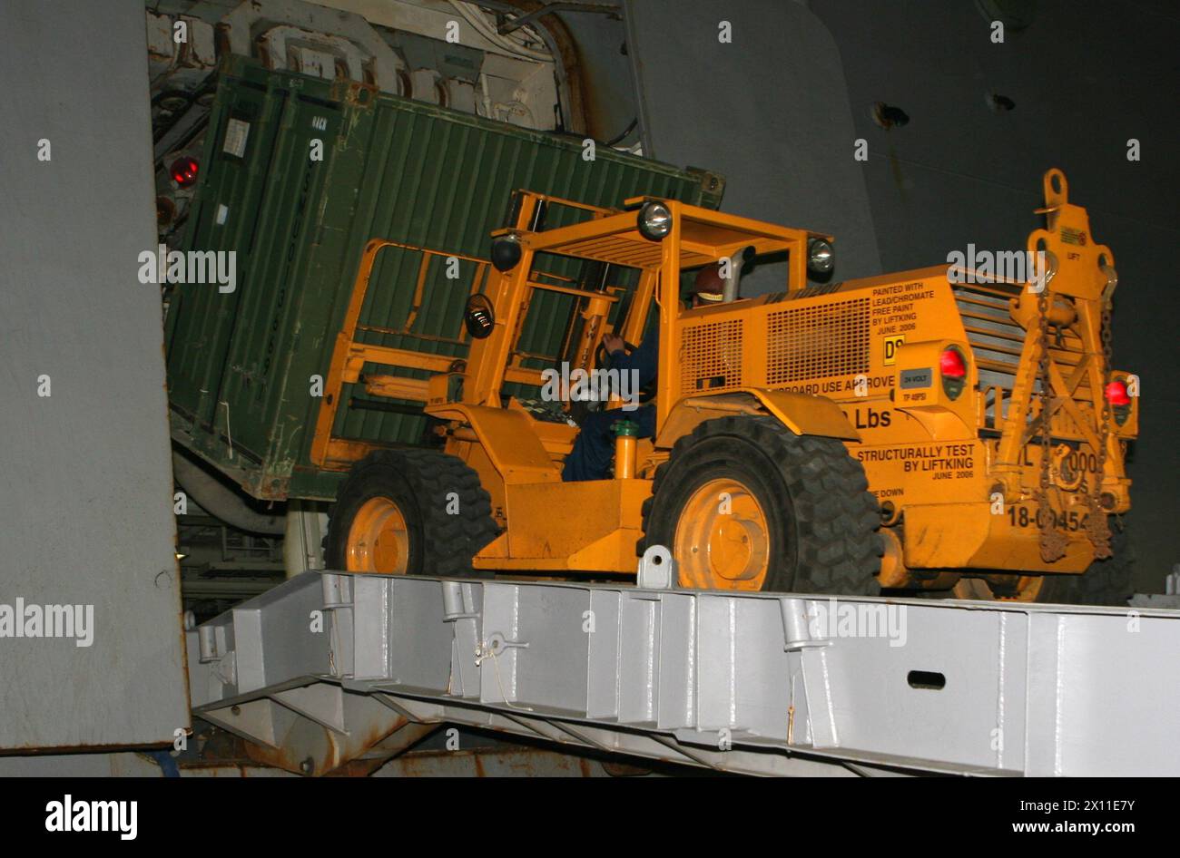 Naval forklift operators load the 22nd Marine Expeditionary Unit's ...