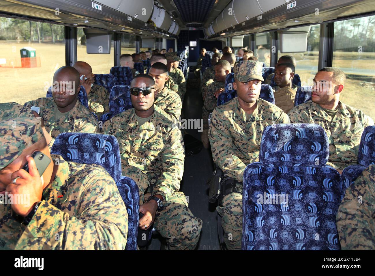 Marines from throughout II Marine Expeditionary sit in a bus waiting ...