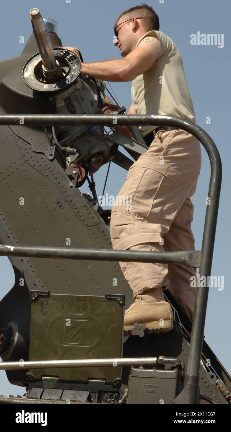 Original Caption: Spc. Robert Munson, UH-60 mechanic for the 209th ...