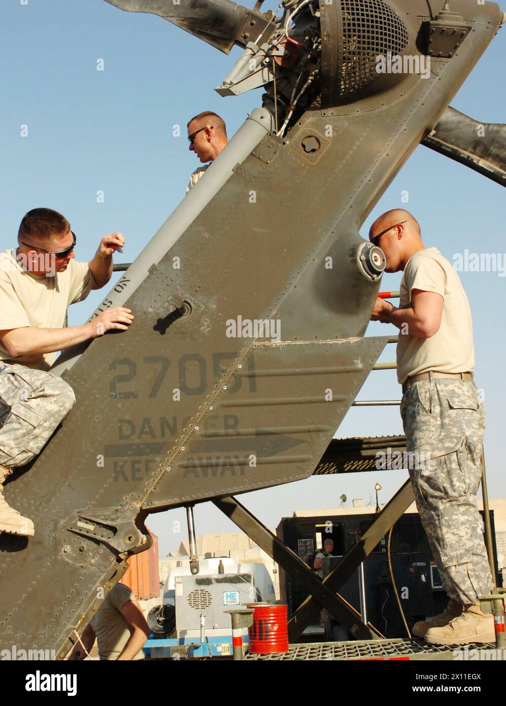 Original Caption: Spc. Parry Moore, CH-47 mechanic, Staff Sgt. Timothy ...