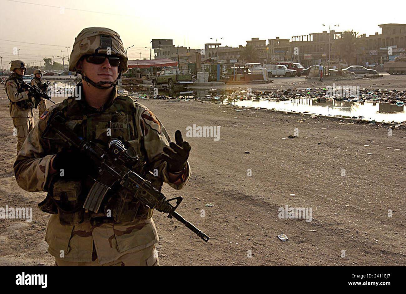 Staff Sgt. Matthew Mercado uses hand signals to move his troops to ...